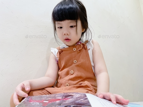 Little girl reading story book Stock Photo by louisong | PhotoDune