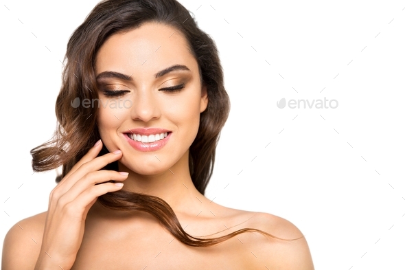 Portrait of a beautiful brunette with open smile on white background ...