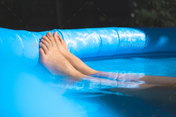 Human feet refreshing water cooldown summer inflatable pool Stock Photo ...