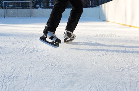 Adult Men's Ice Skates close-up on Ice in Winter outdoor on the move ...