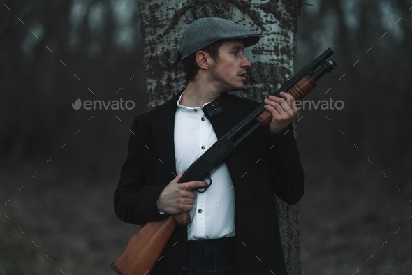 Armed man hiding behind a tree Stock Photo by flrmrz88 | PhotoDune