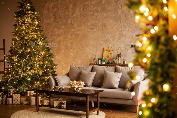 Christmas decor in a loft-style apartment. Large Christmas tree. Stock ...