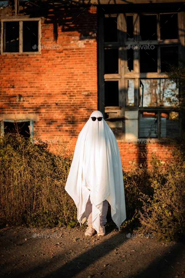 Celebrating halloween. Ghost Challenge 2021. Spooky trend season. A man ...