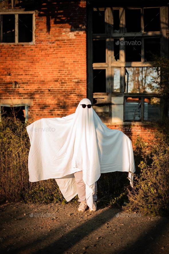 Celebrating halloween. Ghost Challenge 2021. Spooky trend season. A man ...