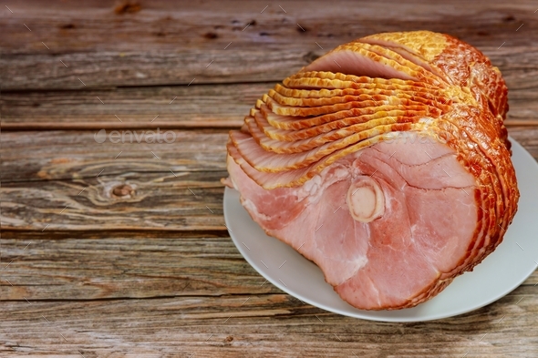 Delicious honey smoked pork ham on rustic wooden background. Stock ...