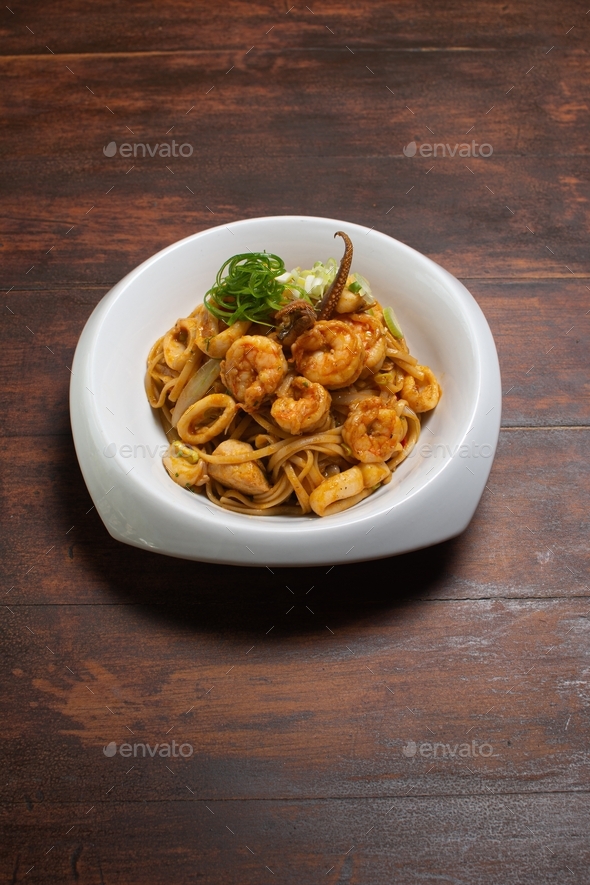 Tallarin saltado Fruto del Mar. Traditional Peruvian pasta with seafood ...
