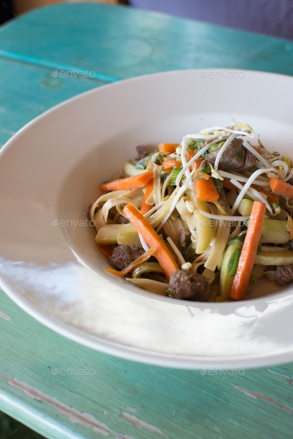 Thai style pasta. Meat and vegetables Stock Photo by jdvolcan | PhotoDune