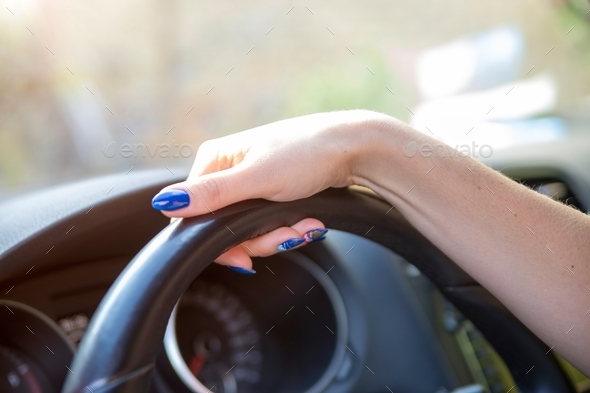 Female hand on steering wheel. Woman driving cars Stock Photo by ...