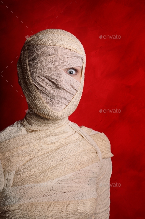 mummy halloween costume. woman wrapped in bandages with only one eye ...