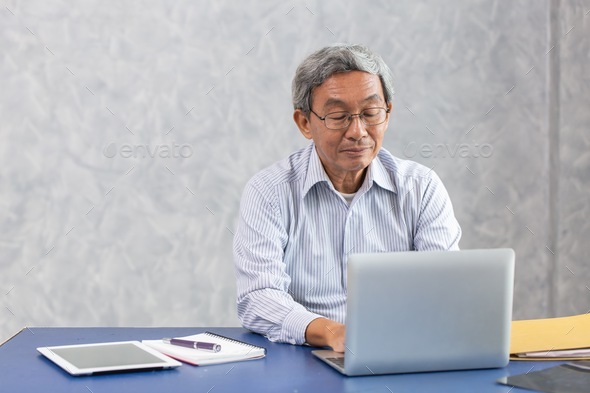 smart old man Asian chinese working with laptop computer Stock Photo by ...