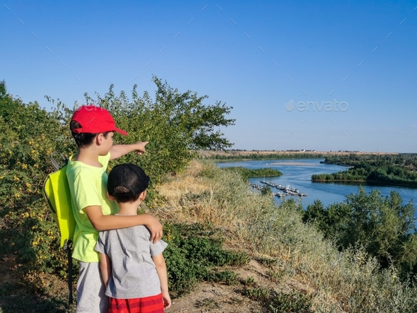 The older brother showing and telling the younger brother about the ...