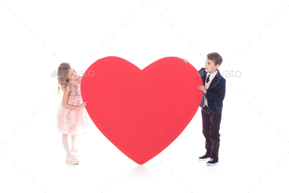 adorable little kids holding big red heart symbol isolated on white ...