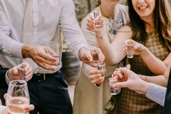 Cheers! Toasting with friends. Drinks with friends. Celebrations. Shots ...