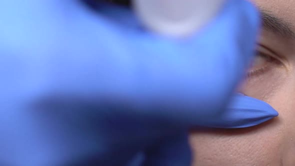Ophthalmologist Dripping Female Eyes With Eye Drop Before Vision ...