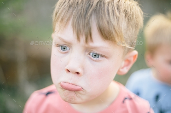 Sad five year old boy with dramatic bottom lip. Stock Photo by ...