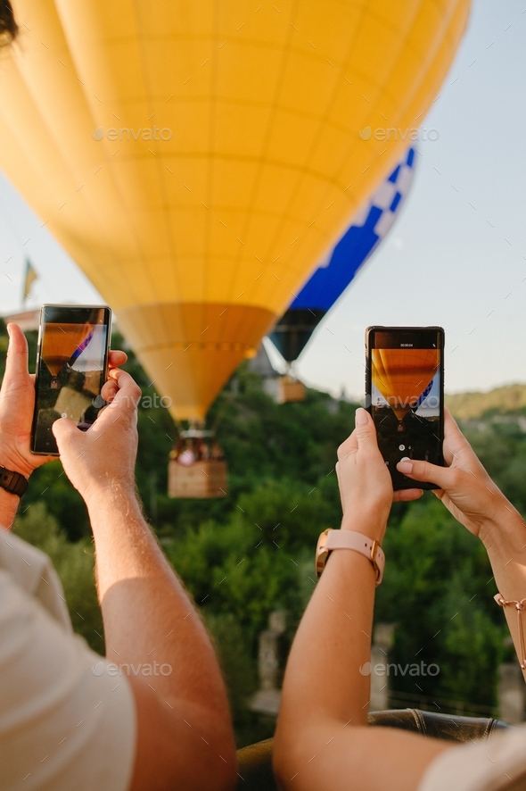people using mobile phones while flying on hot air balloon Stock Photo ...