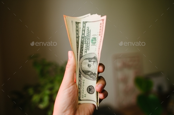dollars pack in hand close up, copy space, background, money, currency ...