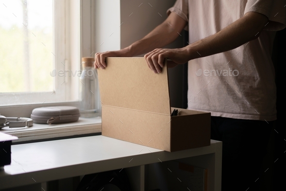 opening cardboard box with new order purchase Stock Photo by MikeShots