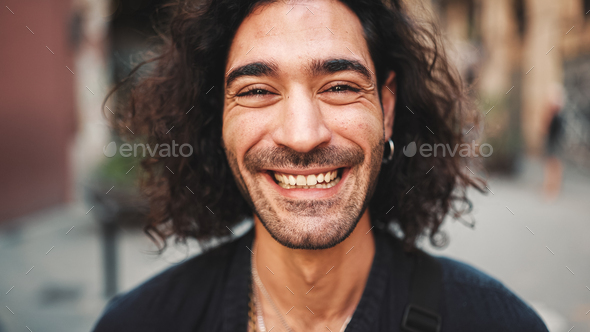 Young attractive italian guy looks into the camera and smiles at old ...
