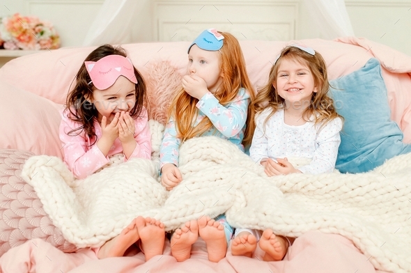 Three little girls are having fun while pajama party Stock Photo by ...