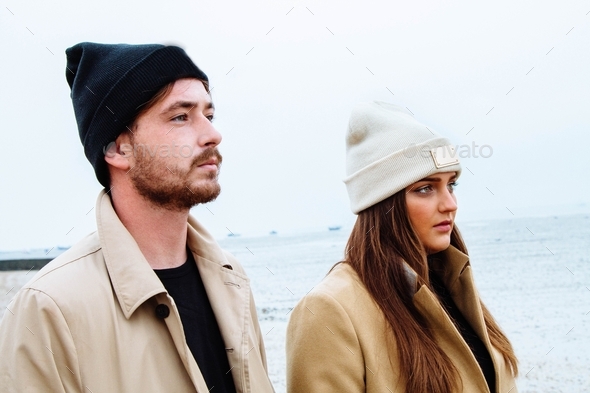 portrait of young adult millennial couple at the seaside beach in ...