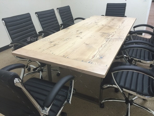 Conference table and black leather office chairs Stock Photo by statuslapa