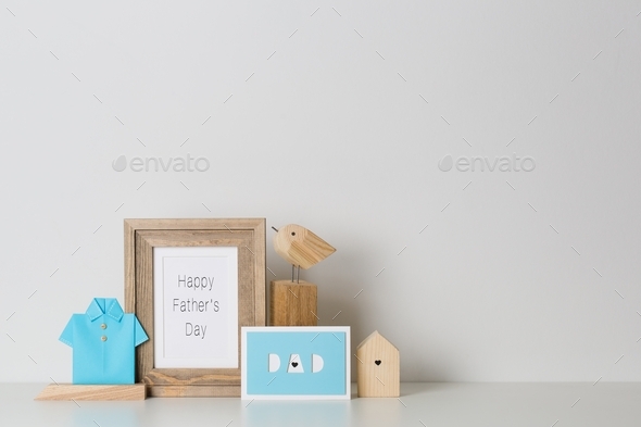 happy father's day. photo frame, card dad and wooden craft toys on ...