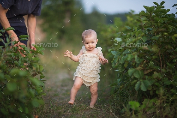 baby learns to walk. first steps of child Stock Photo by _Natalya ...