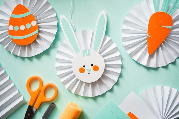 easter paper craft for kids. paper DIY egg, bunny and carrot on mint ...