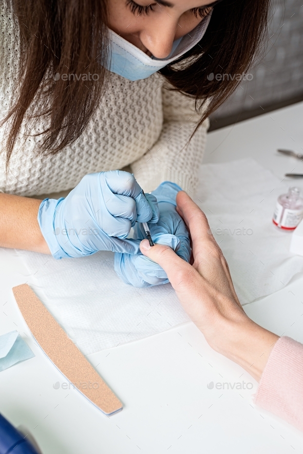 Manicure and pedicure salon, covid-19 and social distance. Manicure ...