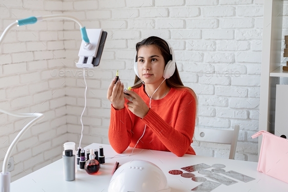 Beautiful caucasian nail master influencer having video chat or making ...