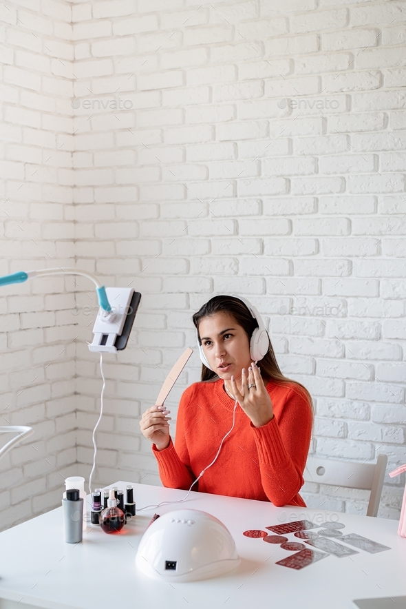 Beautiful caucasian nail master influencer having video chat or making ...