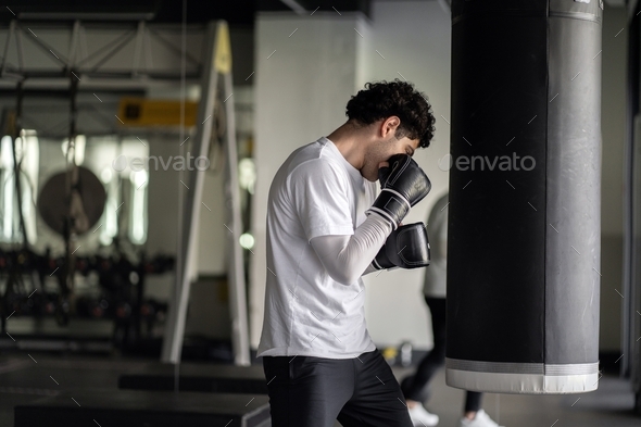 sportsman trainer doing boxing training in the gym, cardio exercises ...