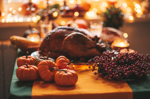 Thanksgiving holiday dinner table setting with fall decoration and ...
