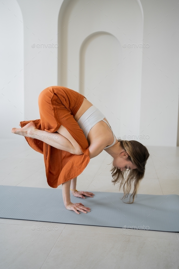 woman yoga trainer workout pose asana in fitness club, healthy ...