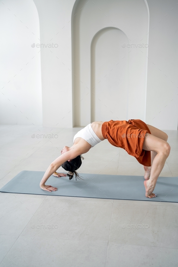 yoga woman trainer workout pose asana in fitness club, healthy ...