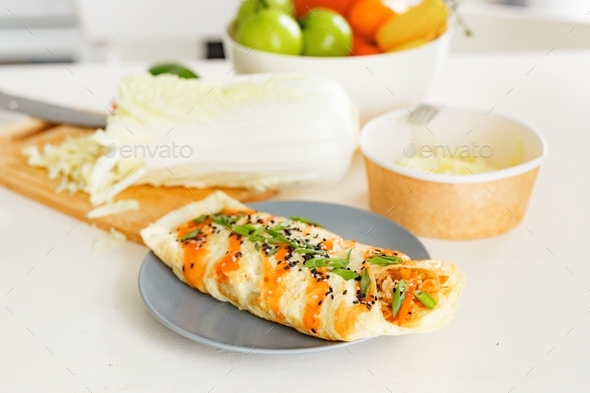 Japanese traditional food omuraisu rice with vegetables on white table ...