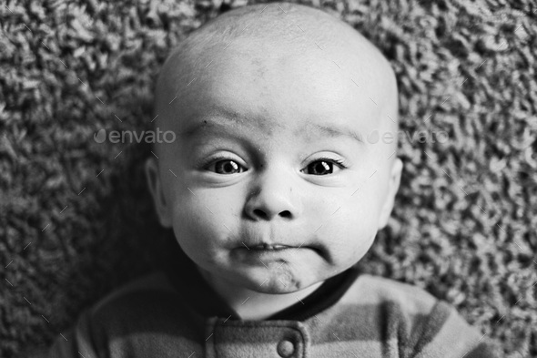 Little baby with funny face overhead shot Stock Photo by hwilson8