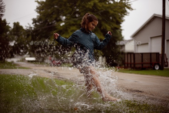 Splashing in the rain puddle rainy day Stock Photo by hwilson8 | PhotoDune