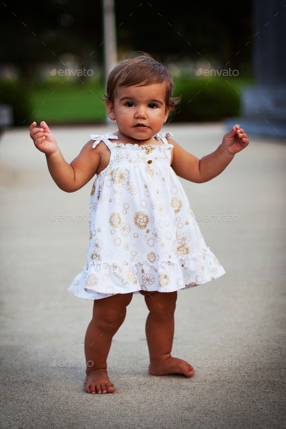 Baby girl standing first learning how to walk Stock Photo by hwilson8
