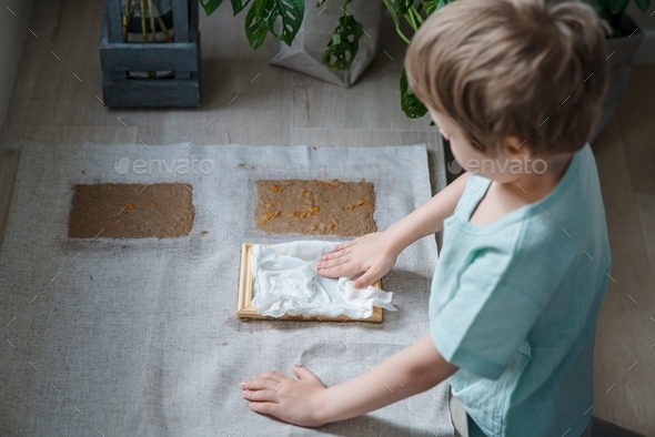 DIY of recycling paper. Kid making paper from recycled materials and ...