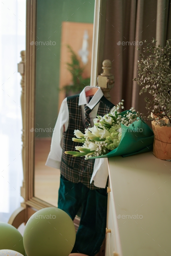 Back to school. Elegant school uniform and a bouquet of flowers for a ...