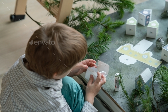 Cute boy cut and paste advent calendar from paper houses. DIY or ...