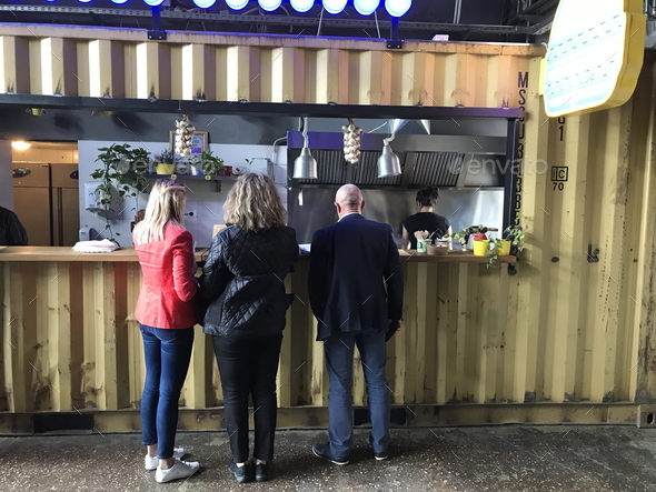 Group of people ordering food in restaurant Stock Photo by vedrana2701