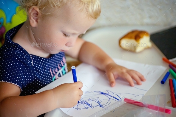 Child's hands drawing drawing with blue felt-tip pen Stock Photo by ...