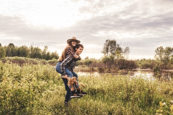 Couple in love on nature, rustic style. Stock Photo by maksimovata