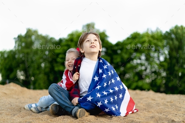 Brother and sister with the American flag, the concept of USA ...
