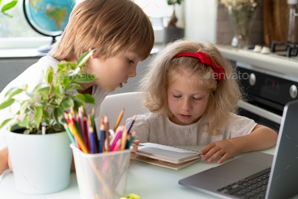 Boy and girl study at home, schoolchildren study online, children and ...