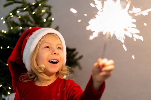 Little cute girl with Bengali fire, emotions of delight, happy children ...