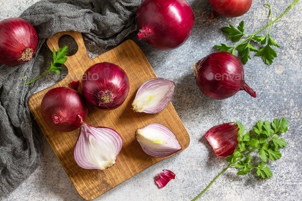 Purple Onions. Fresh whole purple onions and one sliced onion on a ...